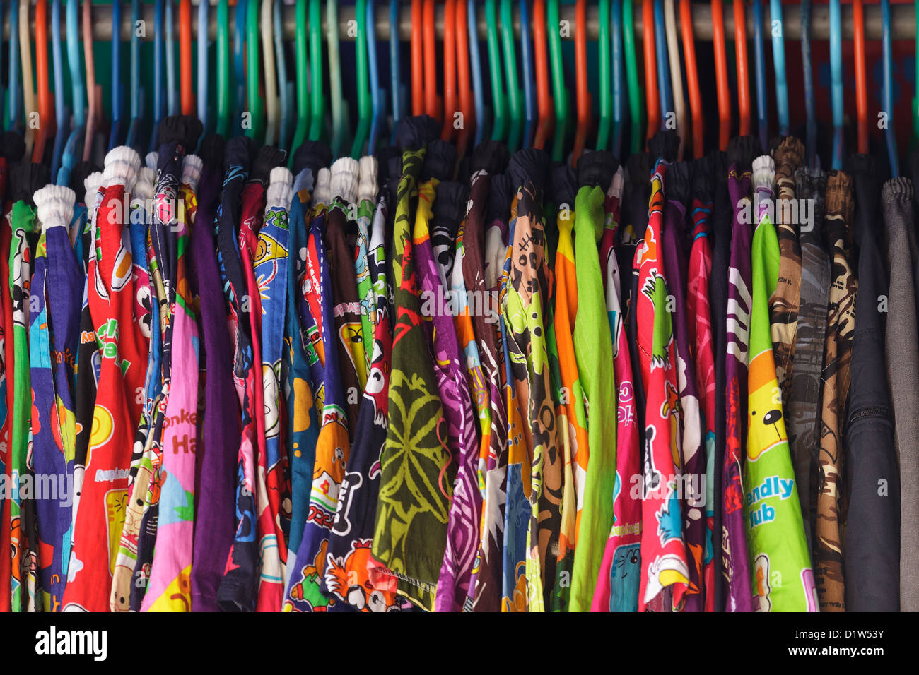 Casual clothes hanging in market, Thailand Stock Photo - Alamy