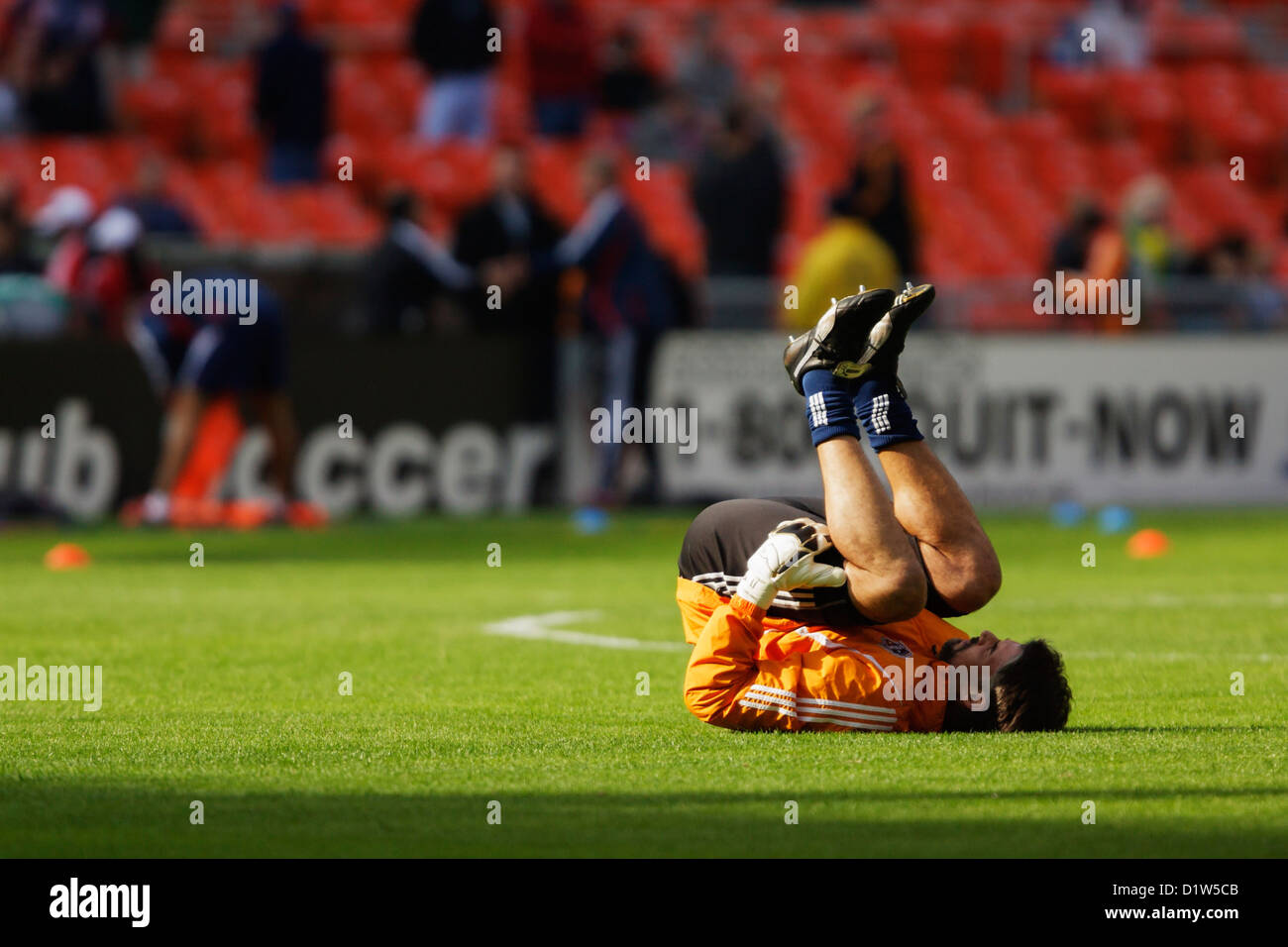 Footballer stretching hi-res stock photography and images - Alamy
