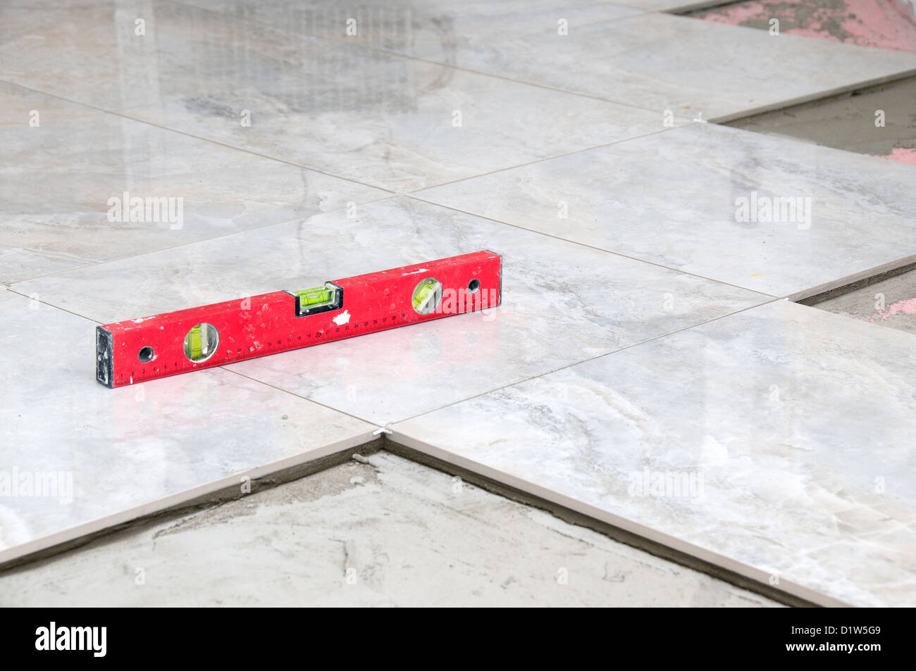 level gray Tiles on a floor Stock Photo - Alamy