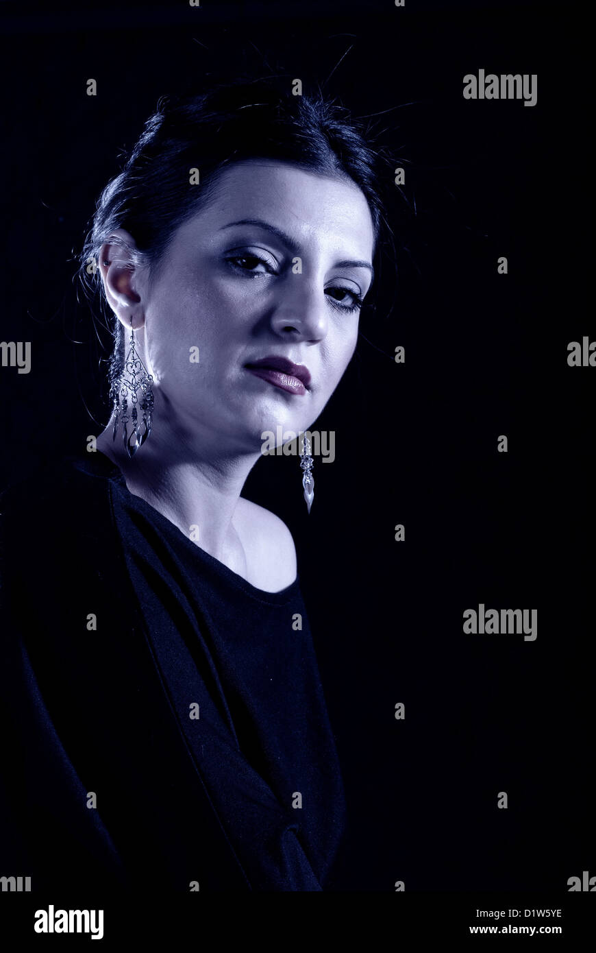 Witch effect on a young adult girl in black Stock Photo - Alamy