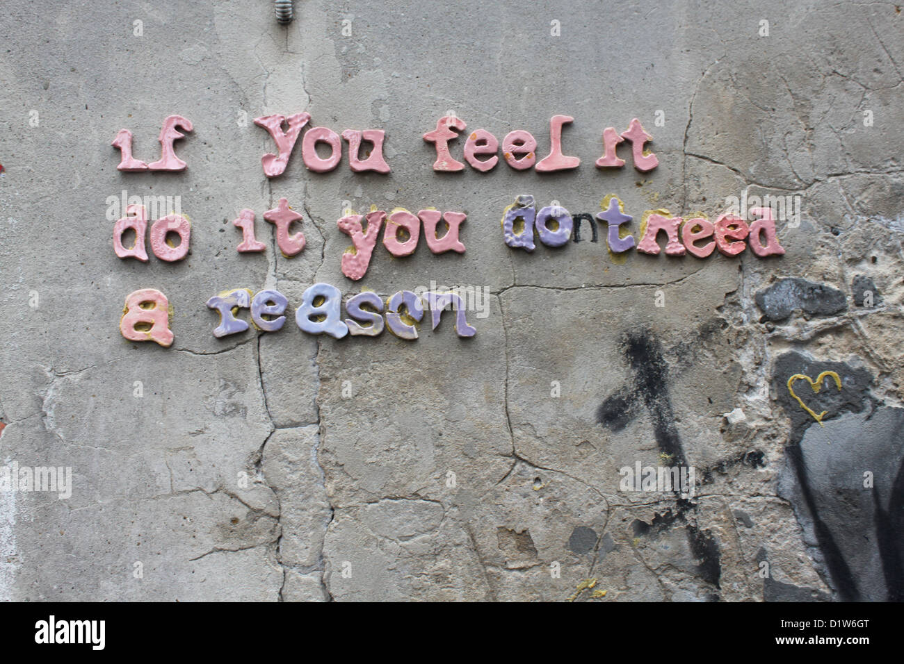 'If you feel it do it, you don't need a reason' quote on a wall Stock ...