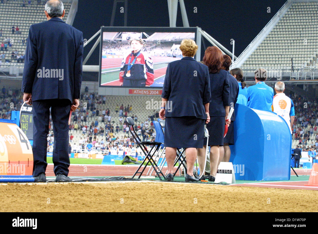 Judges stand for the Greek national anthem Athens Paralympic Games ...