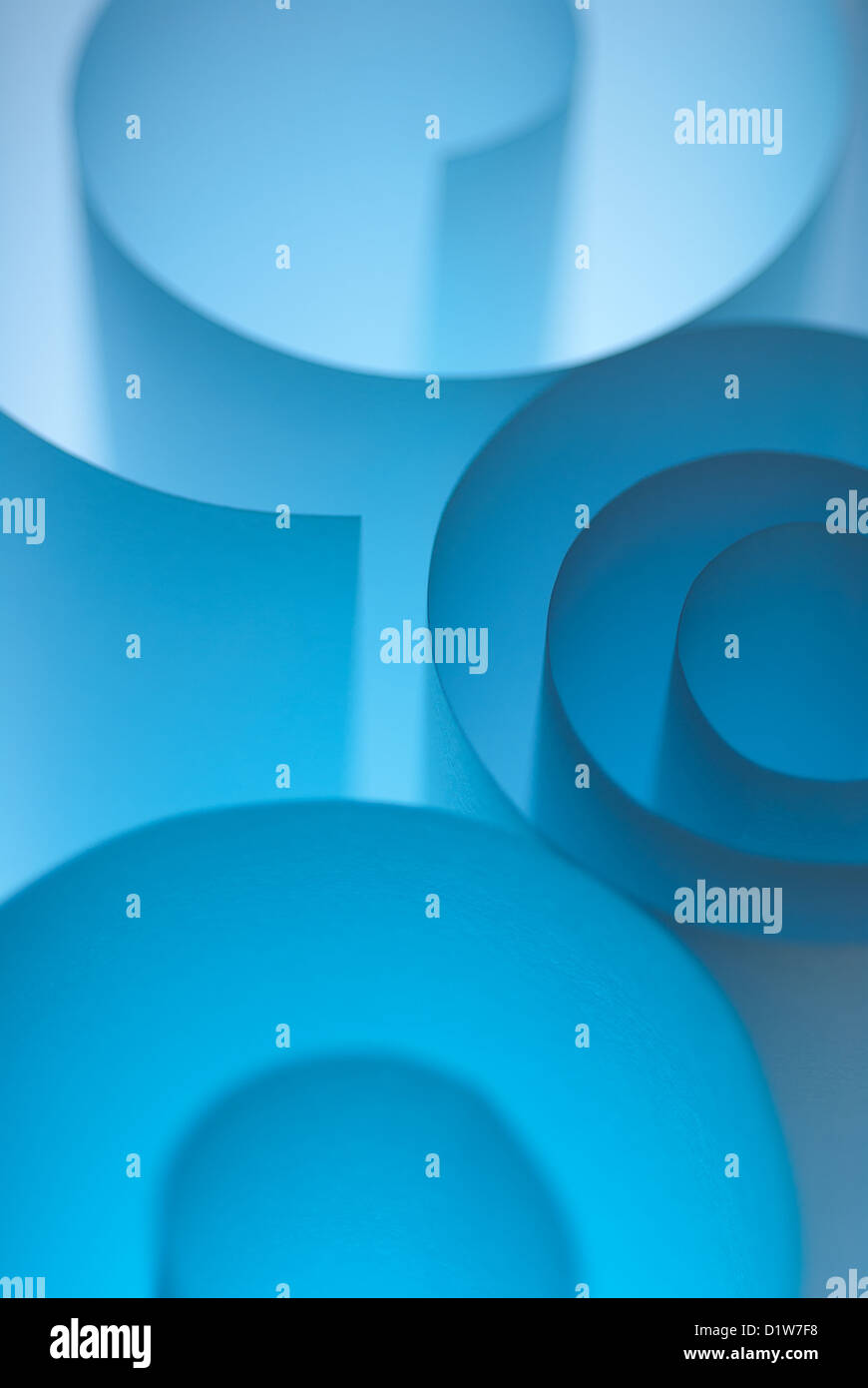 Blue paper rolls under soft light in studio Stock Photo - Alamy