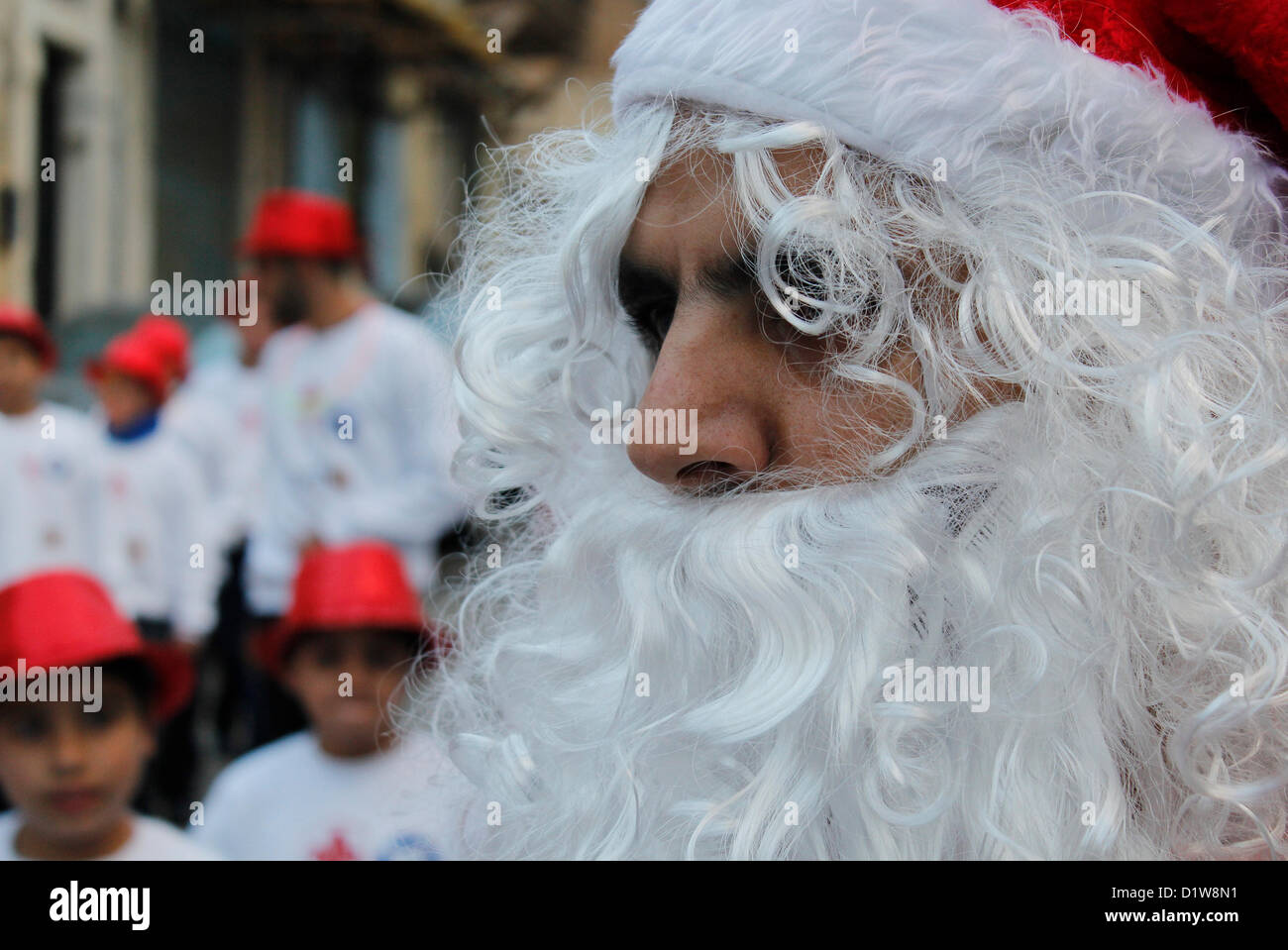 An Israeli-Arab Christian dressed as Santa Claus takes part in the ...