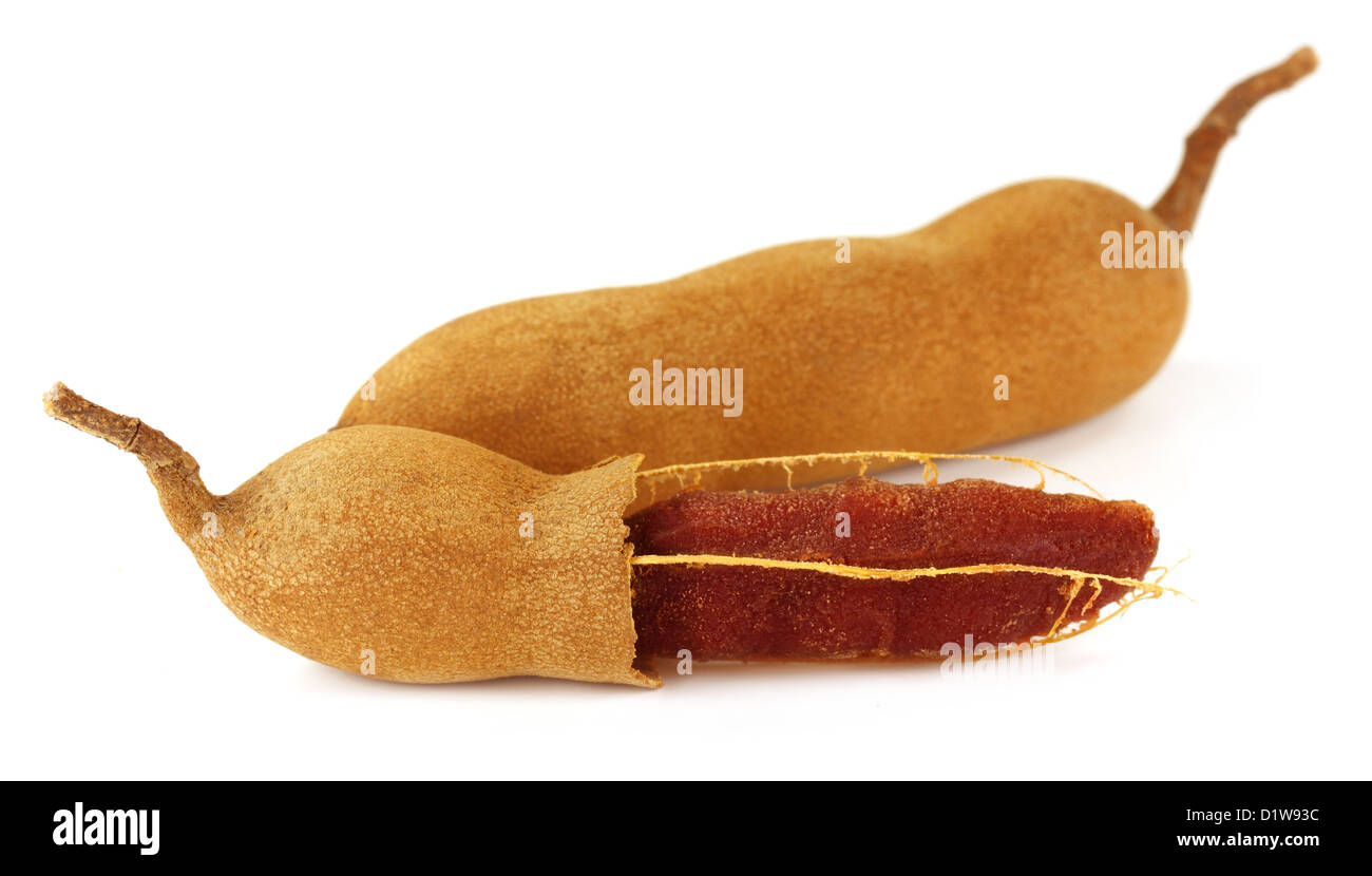 Ripe tamarind over white background Stock Photo - Alamy