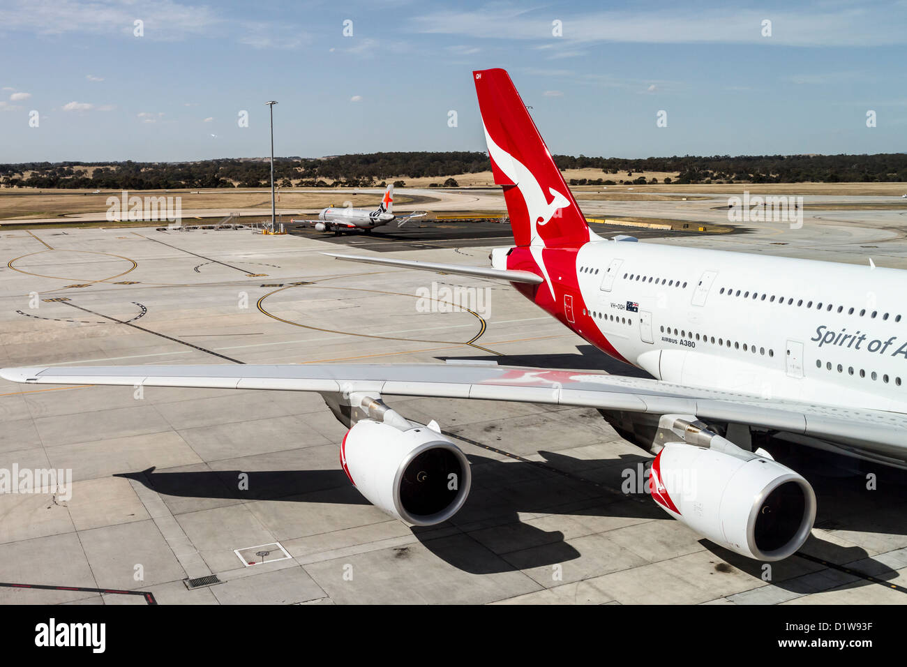 Qantas A380 airplane showing wing, tail and engine parked at terminal ...