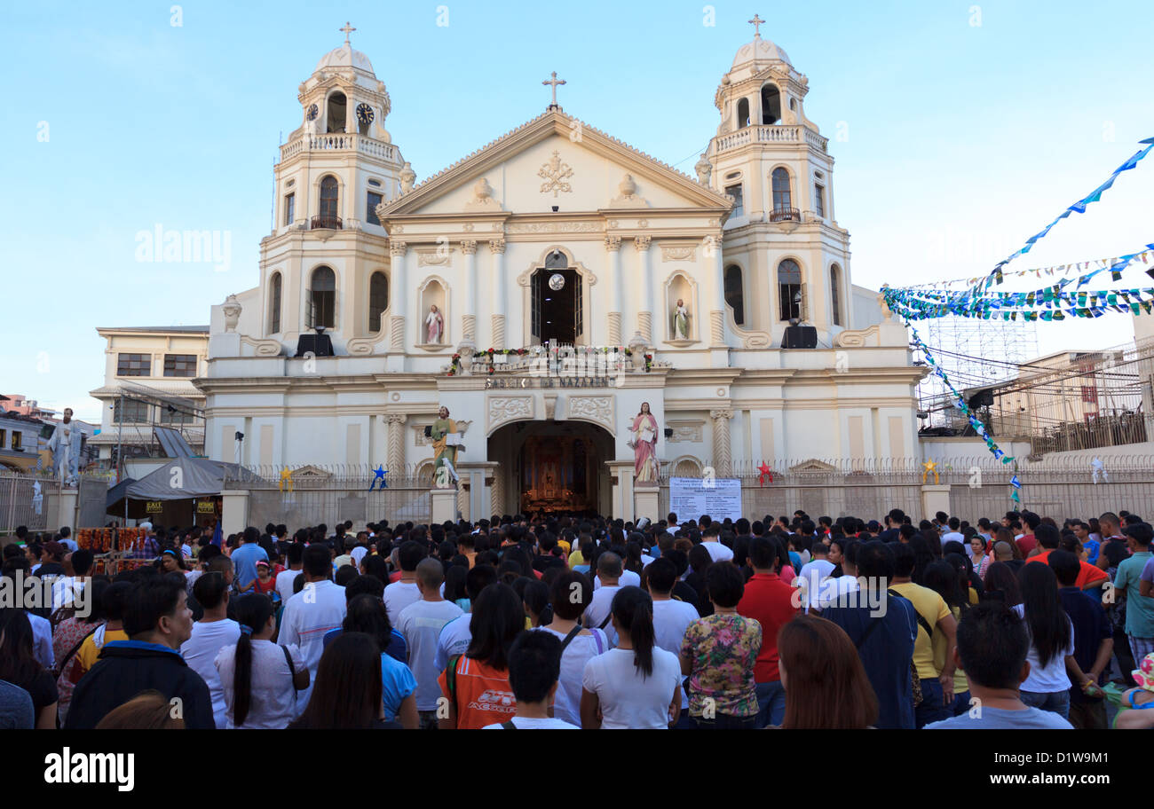 Thousands of Catholic devotees join the procession of the life-size ...