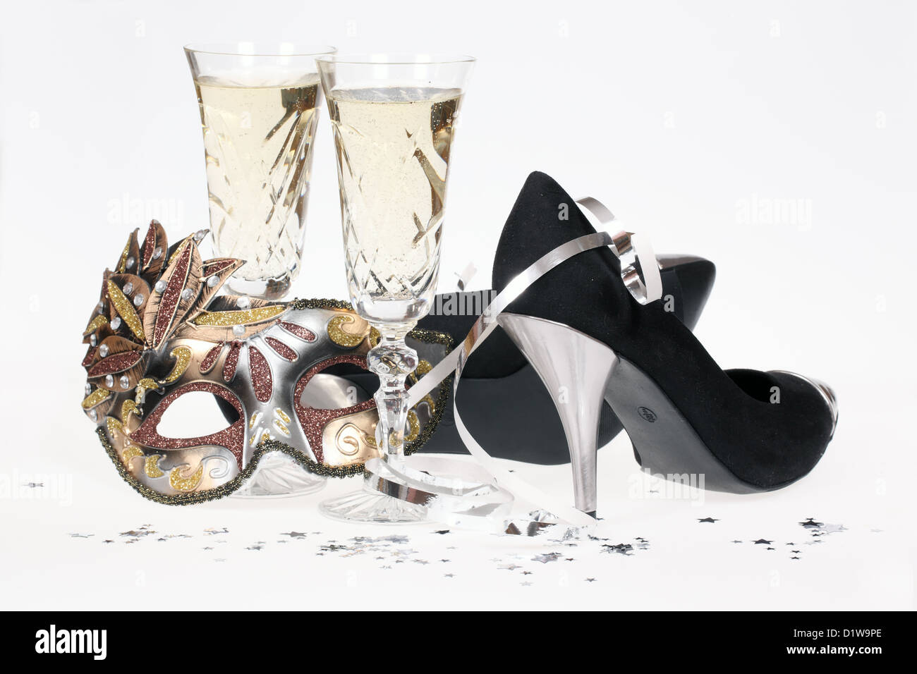 Masquerade mask, champagne and high heel shoes Stock Photo - Alamy