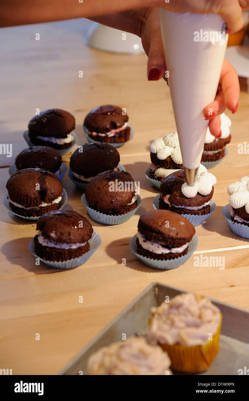 The preparation of tastefully beautiful cupcakes Stock Photo - Alamy