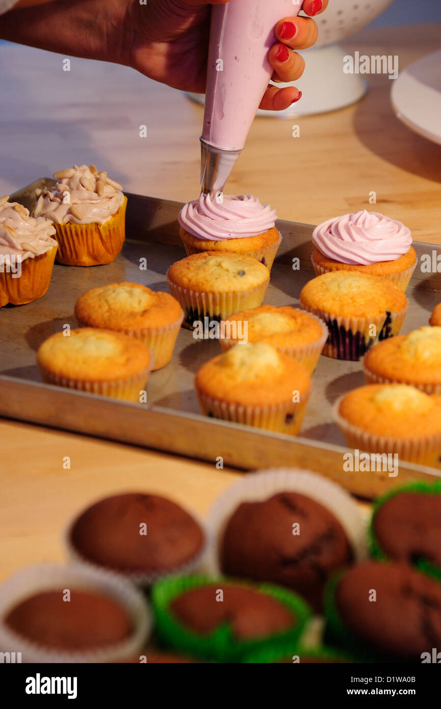 The preparation of tastefully beautiful cupcakes Stock Photo - Alamy