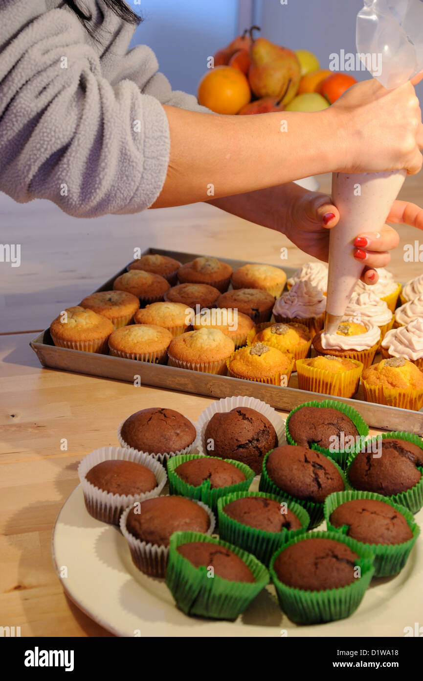 The preparation of tastefully beautiful cupcakes Stock Photo - Alamy
