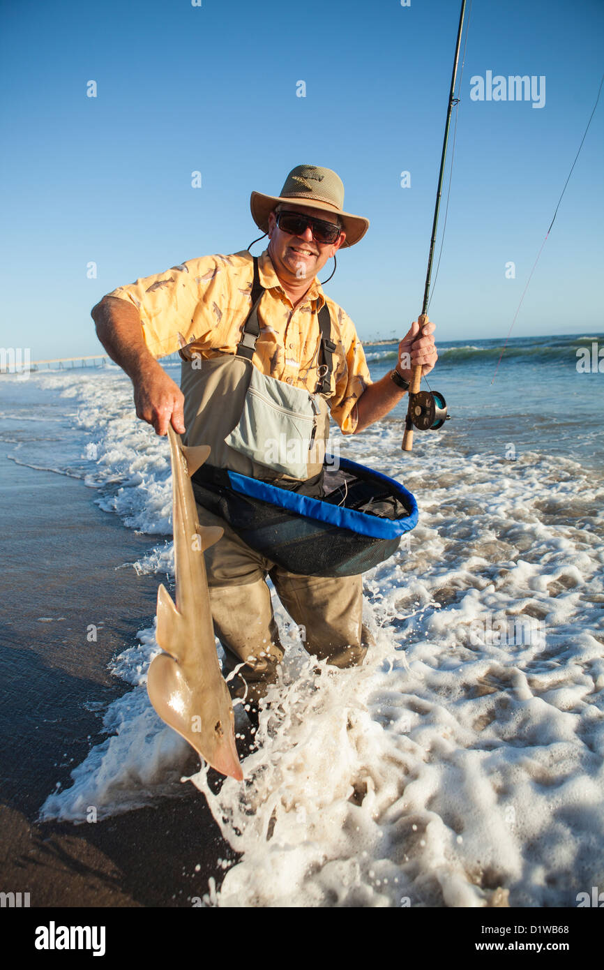 fly fisherman catching a shovel nose shark, La Conchita Beach near ...