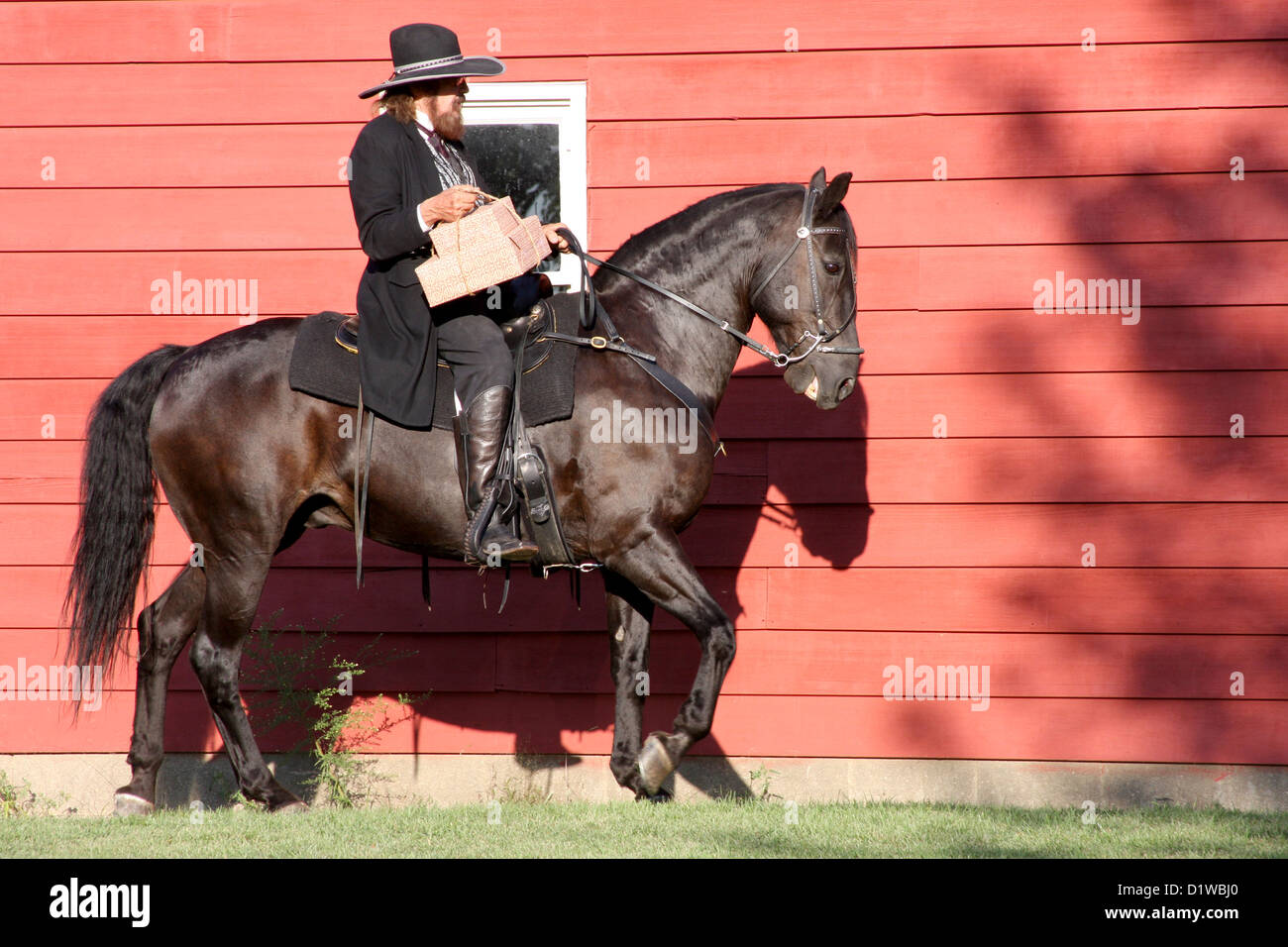 A cowboy delivering Christmas present by horseback Stock Photo - Alamy