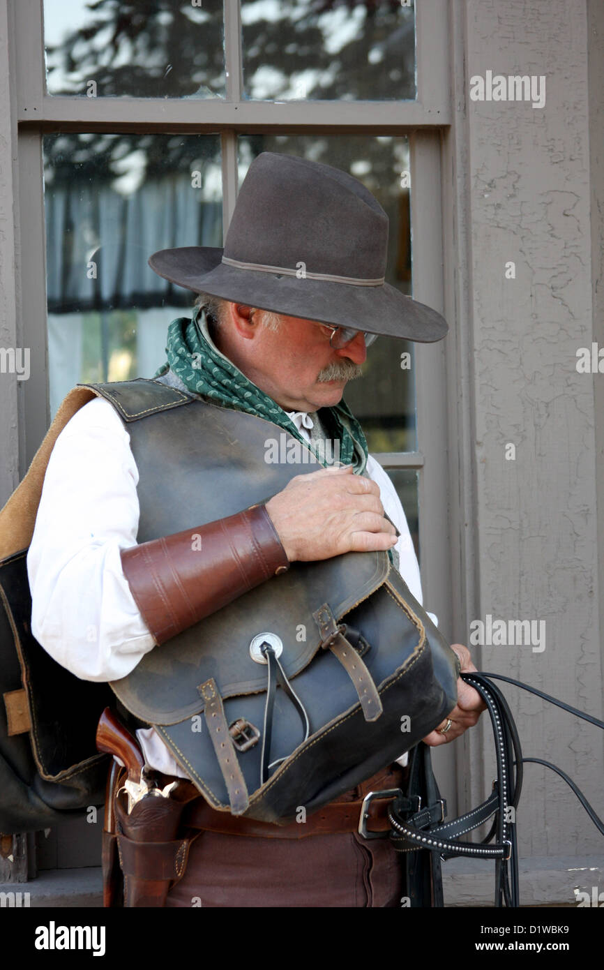 A cowboy by an old west store window Stock Photo - Alamy