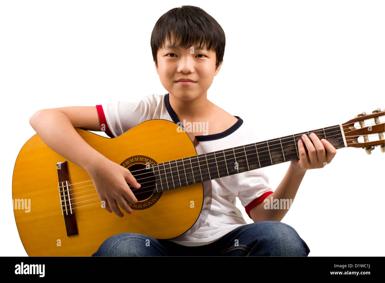 a young asian teenager playing guitar Stock Photo - Alamy