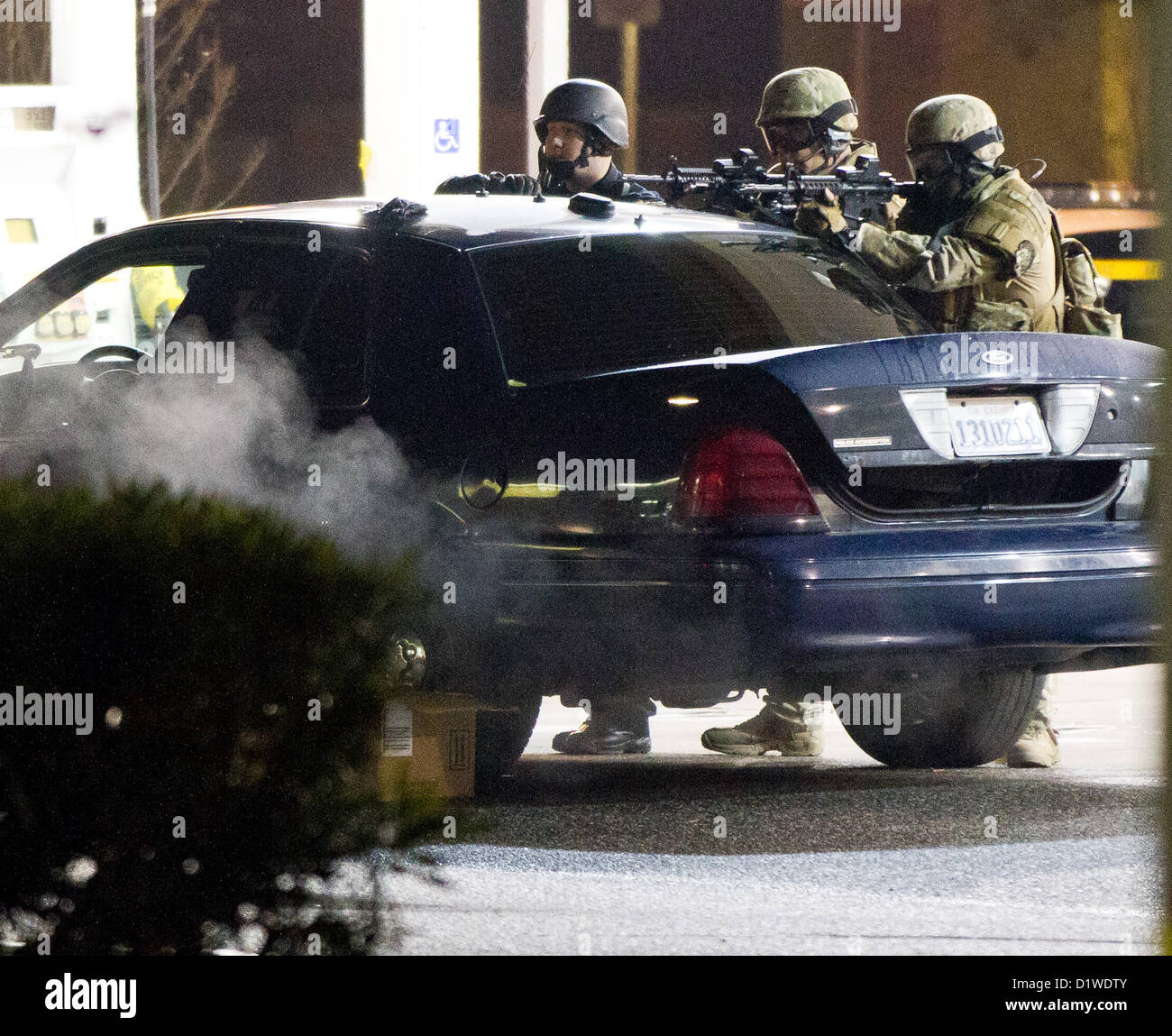 Jan. 6, 2013 - Modesto, CA, USA - Modesto SWAT members take cover ...