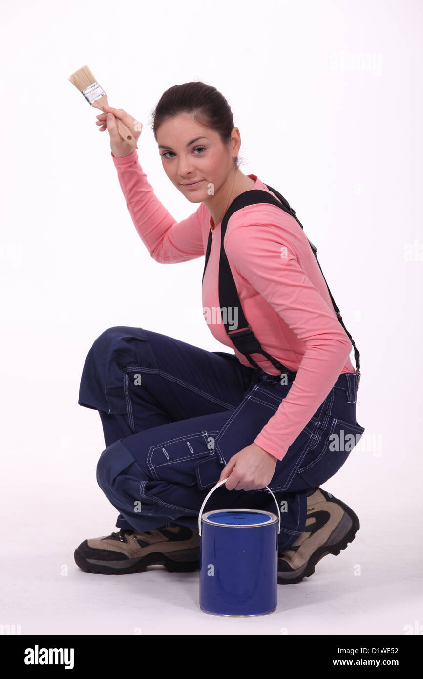 Stooping woman holding hi-res stock photography and images - Alamy