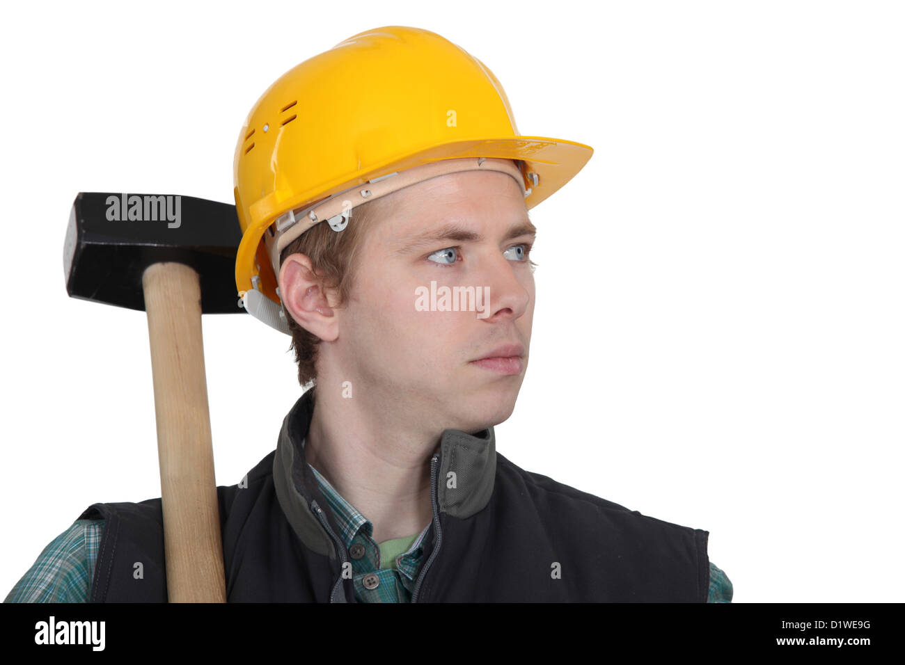 Young manual worker stood with sledge-hammer Stock Photo - Alamy