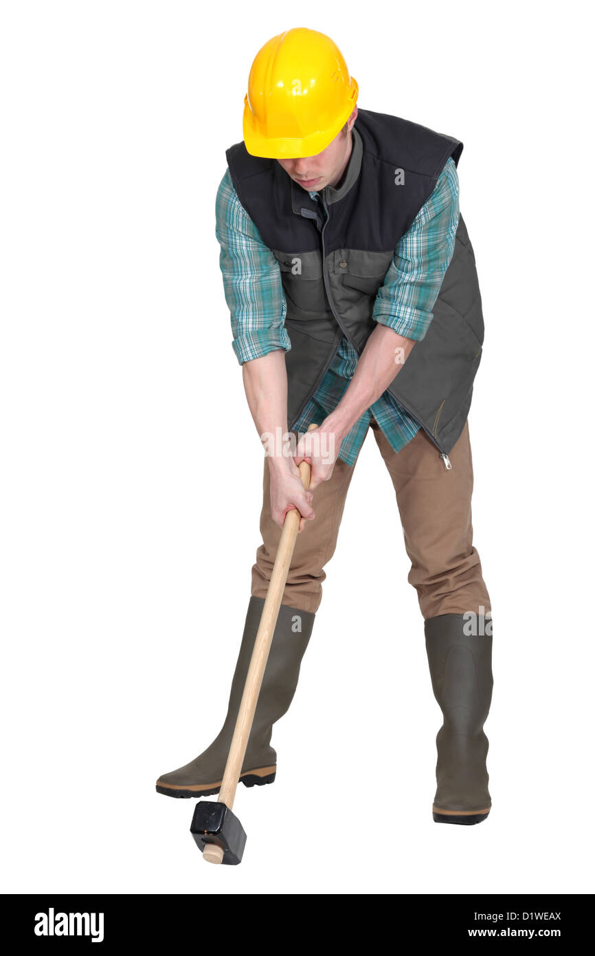 Man trying to lift sledge hammer hi-res stock photography and images ...