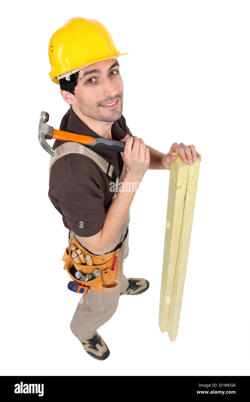A carpenter with a hammer Stock Photo - Alamy