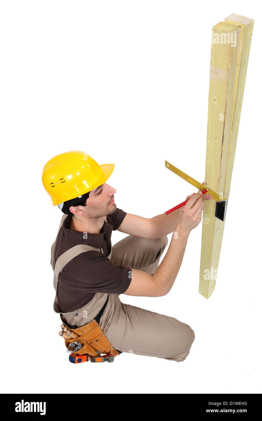 Carpenter marking wood Stock Photo - Alamy