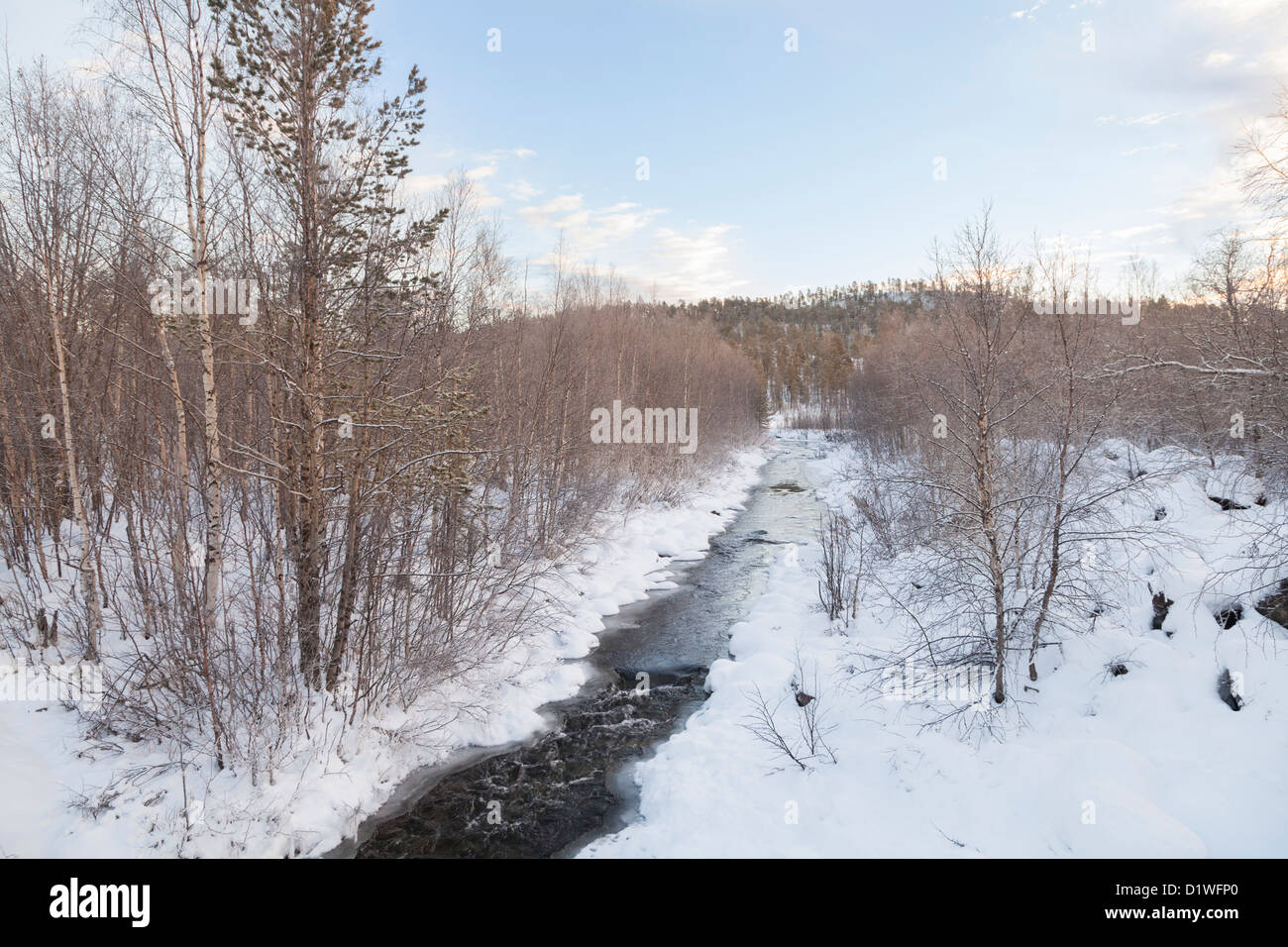 Lake flowing in the frozen landscape in Inari, Lapland, Finland Stock ...