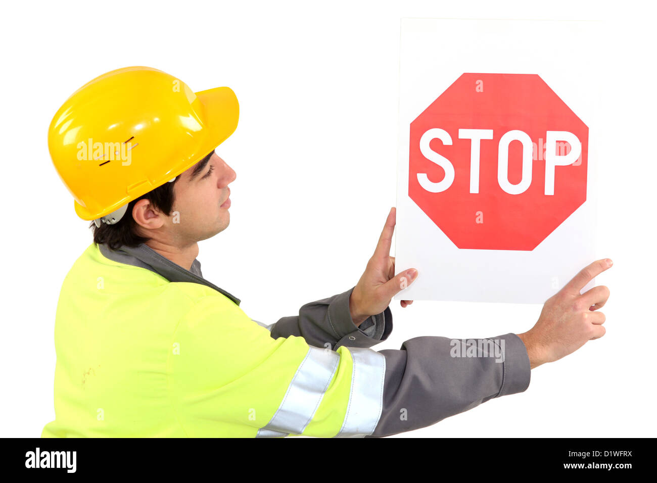 Laborer showing stop sign Stock Photo - Alamy