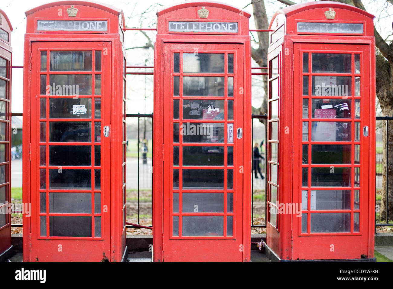 Three Red Telephone boxes in a row Stock Photo - Alamy