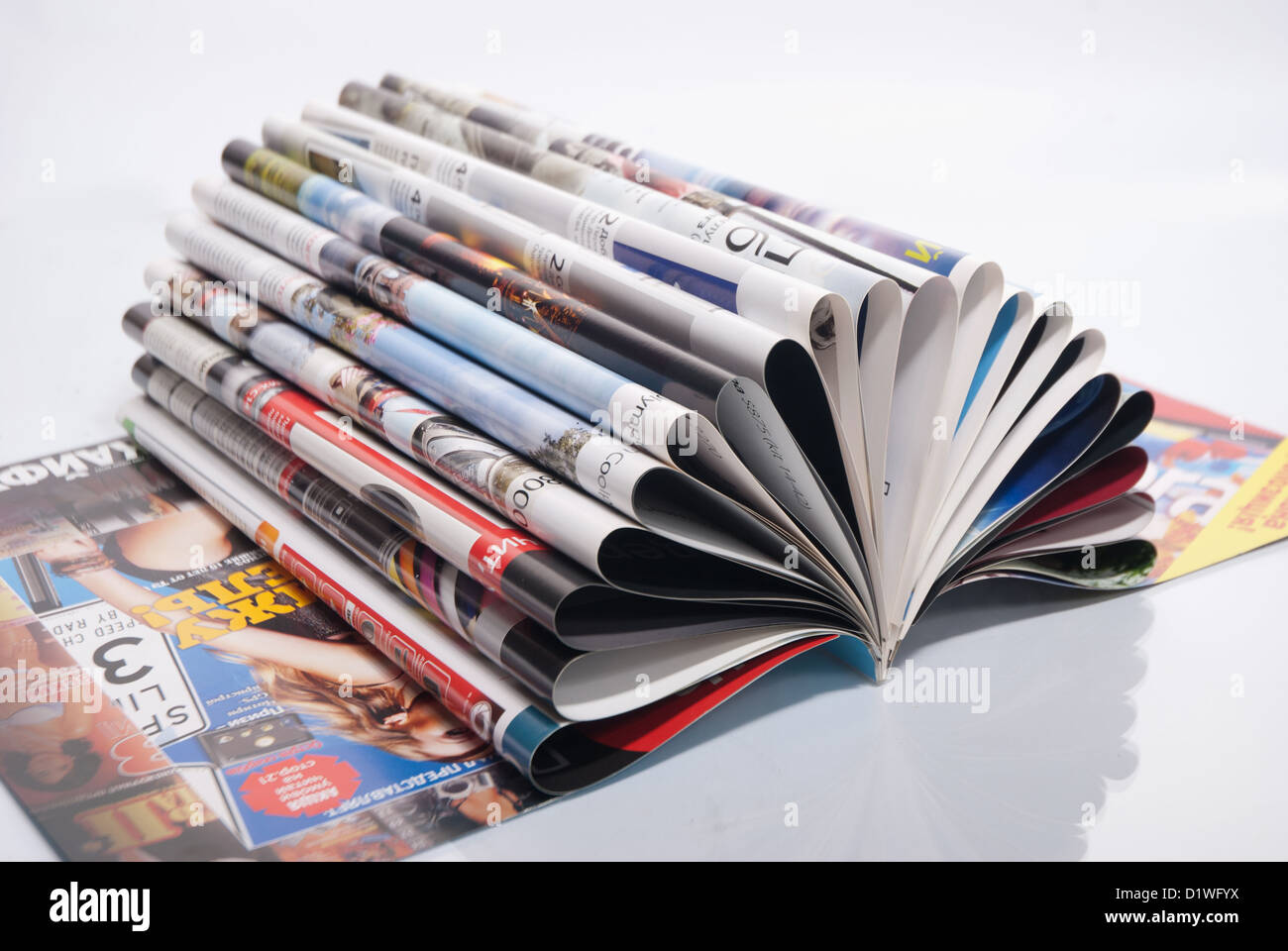 Open magazine with curled pages. Close-up Stock Photo - Alamy