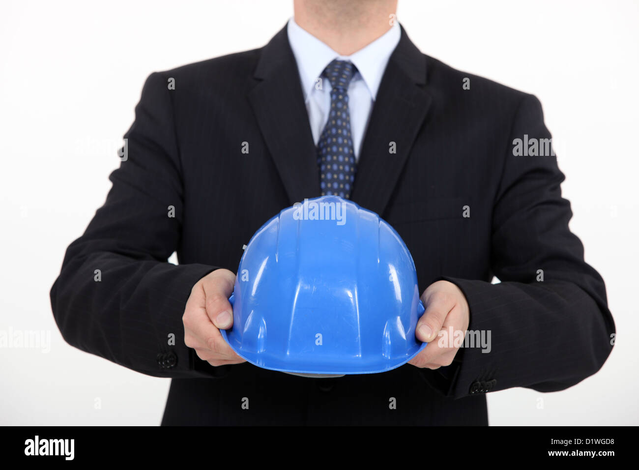 Man holding hard hat Stock Photo - Alamy