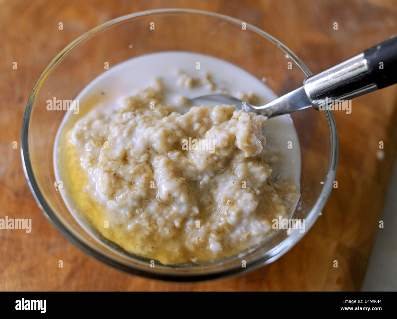 Bowl of Scotch Porridge Oats with honey and milk for a warming and ...