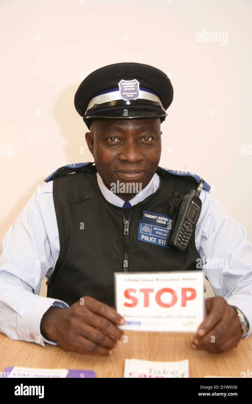 Community Police Officer displaying advice leaflet on crime prevention ...