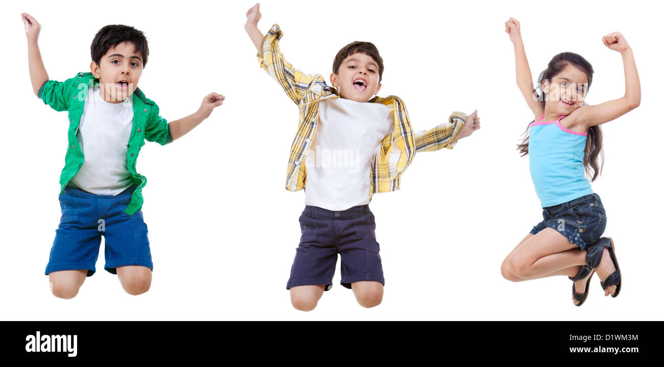 Happy children jumping over white background Stock Photo - Alamy