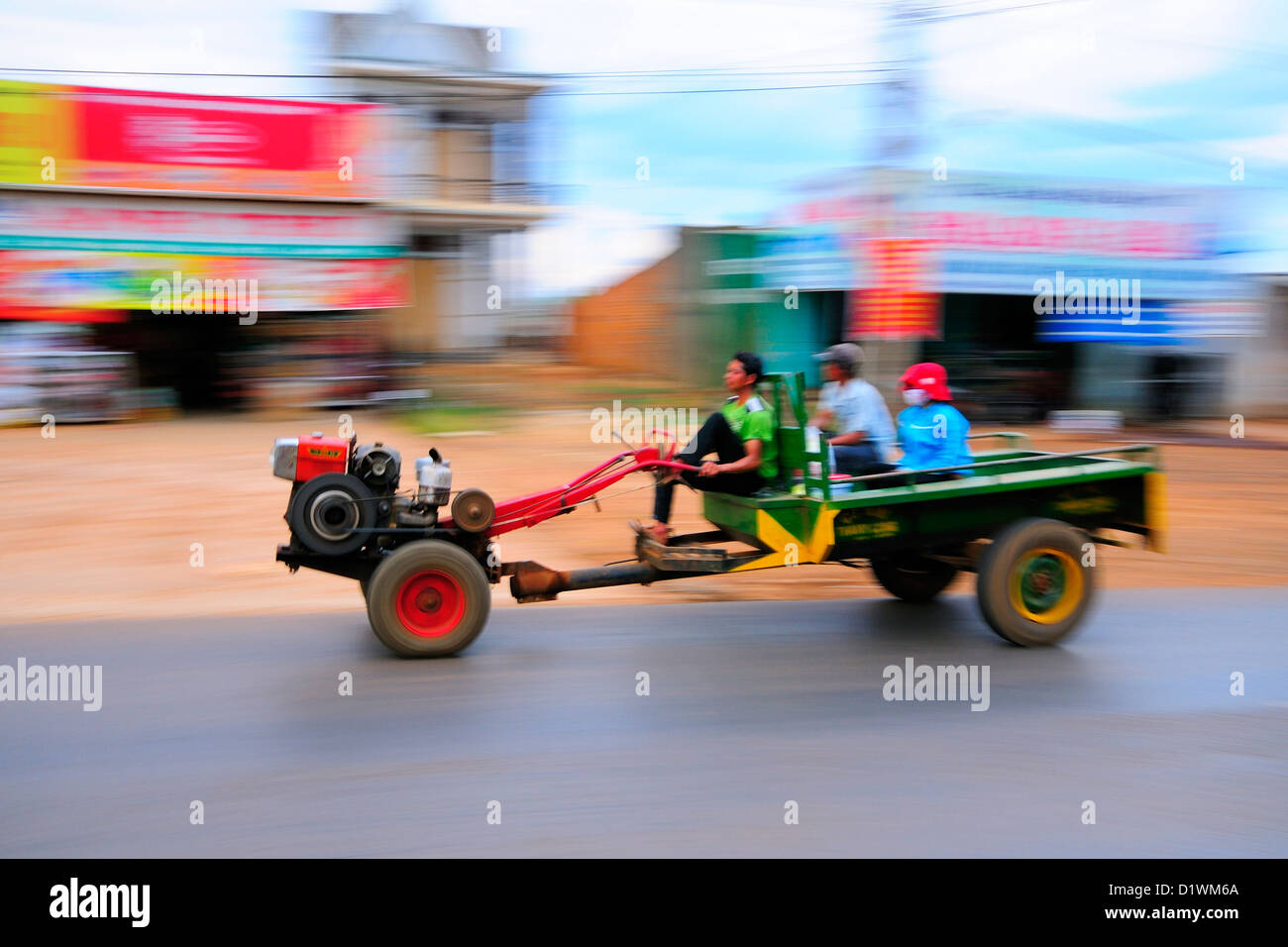 Xe máy cày (vietnamese tractor and trailer) with passengers. Central ...