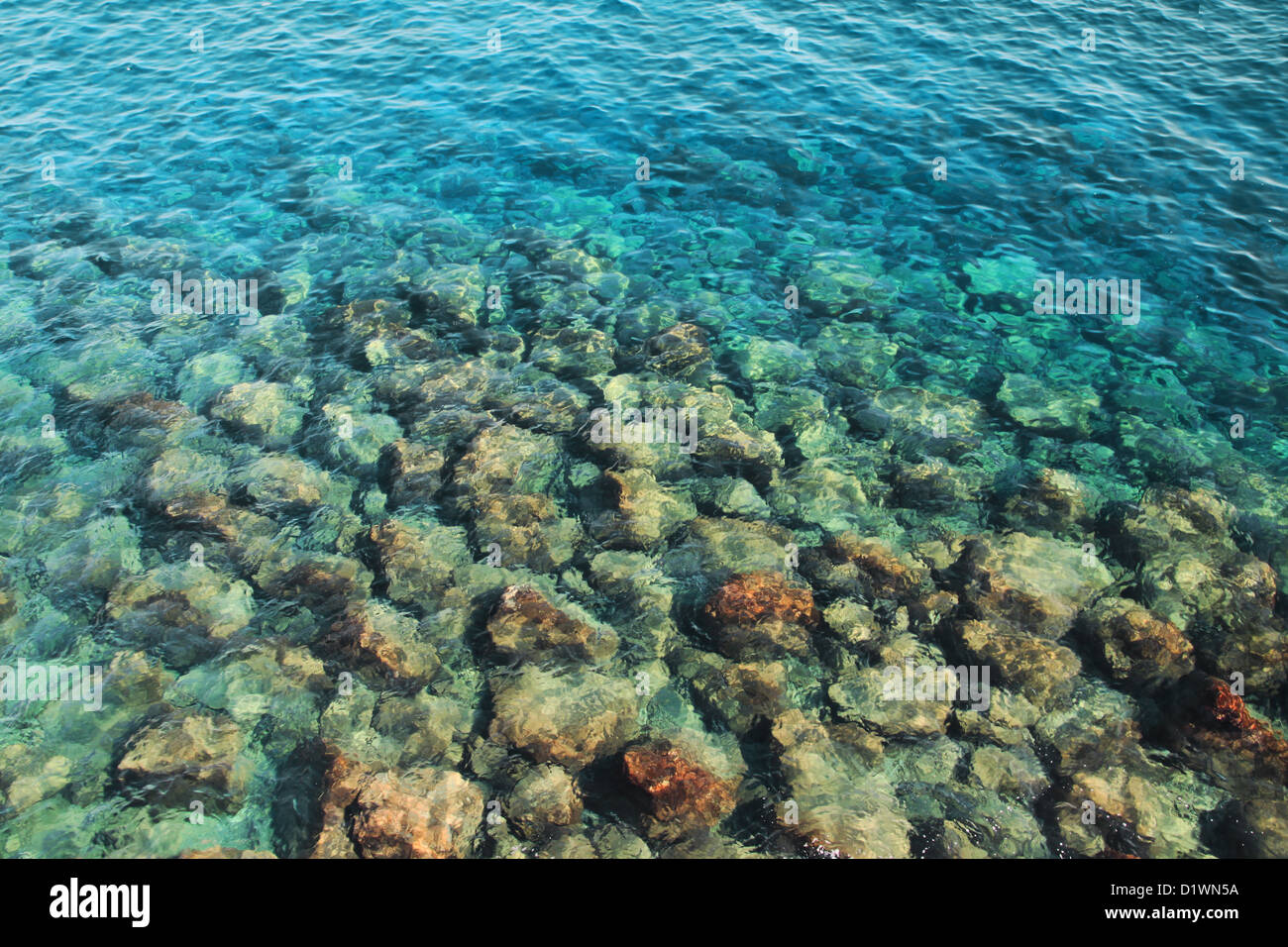 Reefs in transparent azure water Stock Photo - Alamy