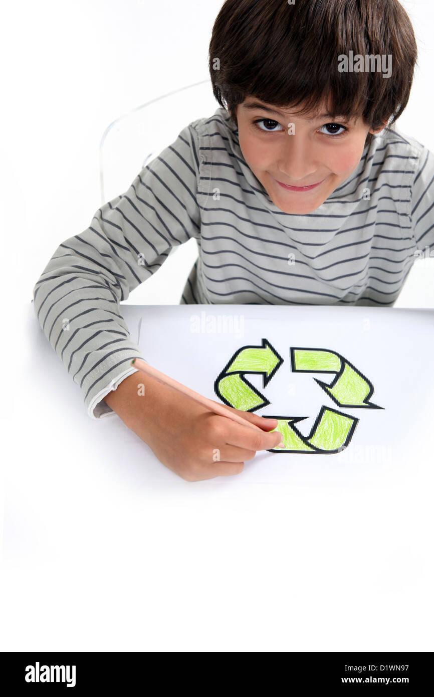 Small boy drawing recycle logo Stock Photo - Alamy