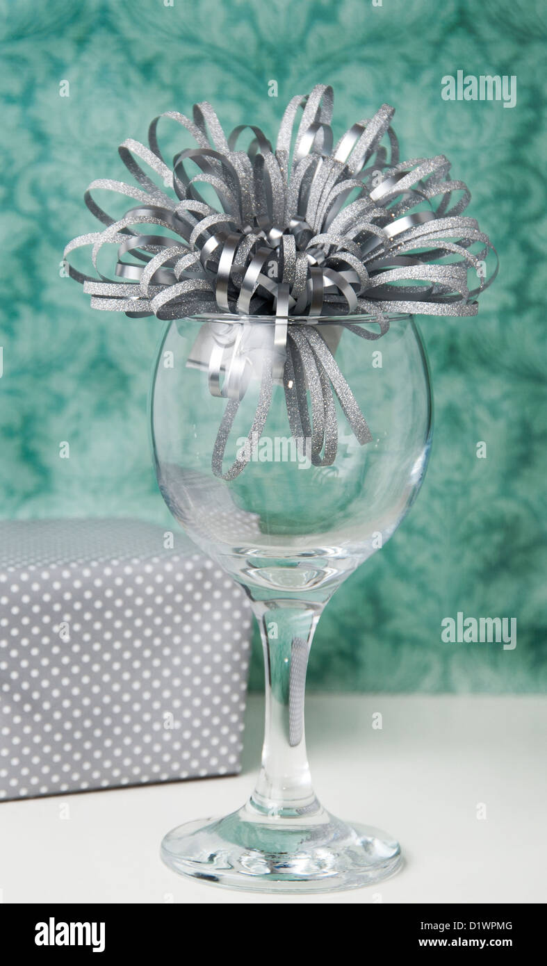 Wine glass, ribbon bow, and gift box Stock Photo - Alamy