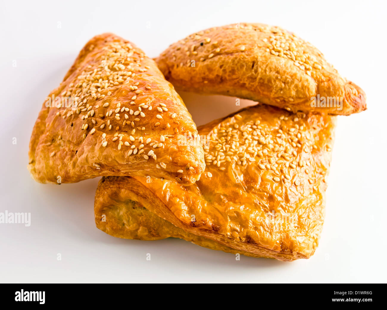 three fresh baked pie with sesame Stock Photo - Alamy