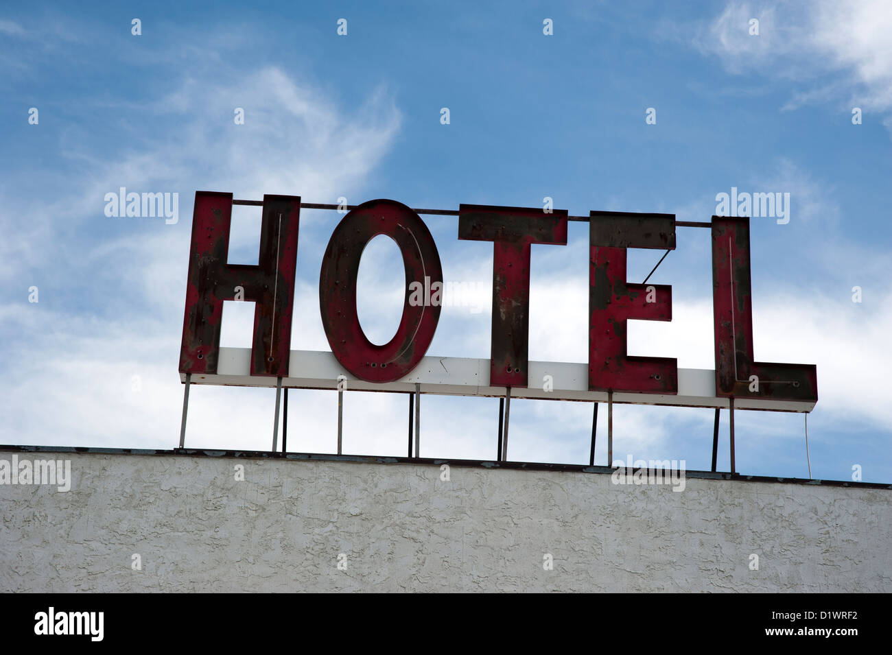 A hotel sign on roof of rundown hotel Stock Photo - Alamy