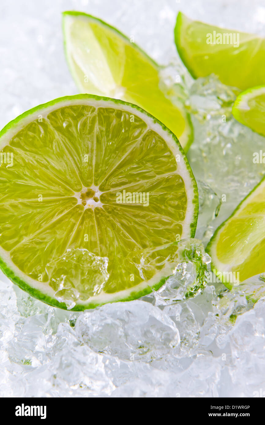 lime pieces and ice, focus on a center Stock Photo - Alamy