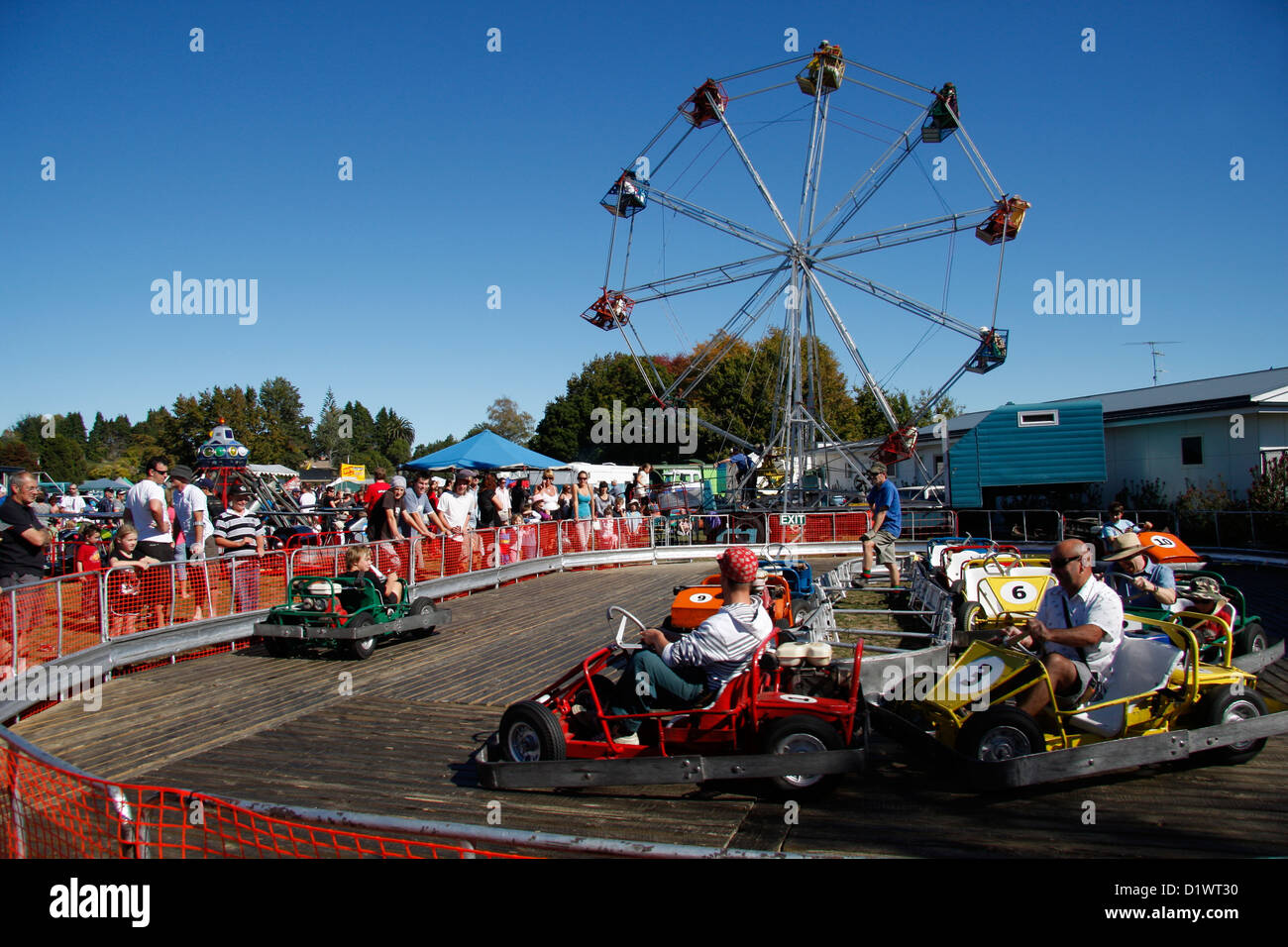 Dodgem cart track in front of ferris wheel at the fairground at Mapua ...