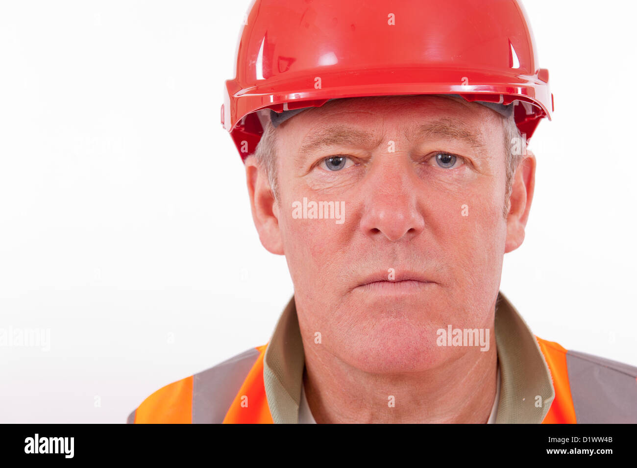 Close up portrait of a construction worker wearing a red hard hat and ...