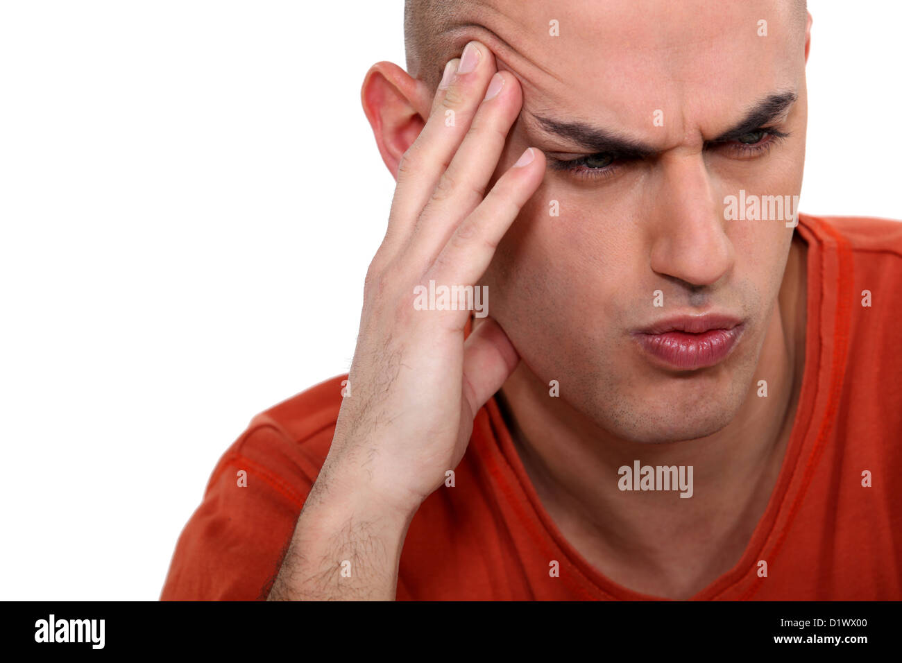 Man grimacing, white background Stock Photo - Alamy