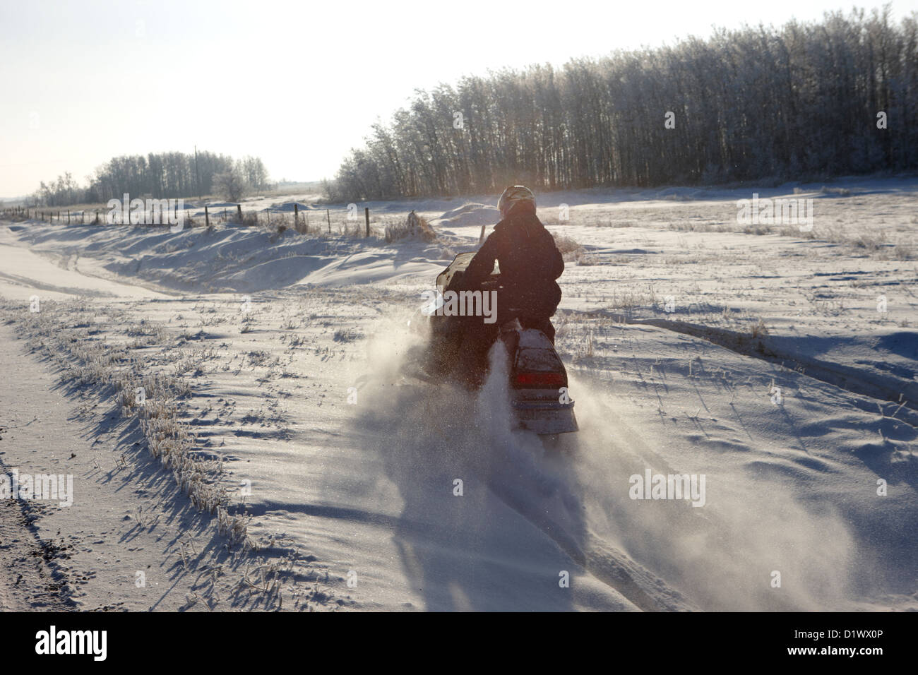 Man driving snowmobile hi-res stock photography and images - Alamy