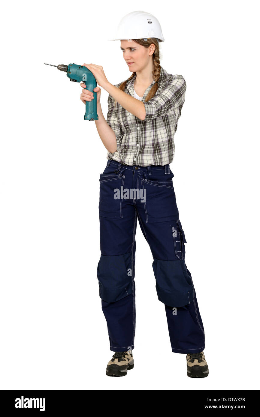 Tradeswoman using a drill Stock Photo - Alamy