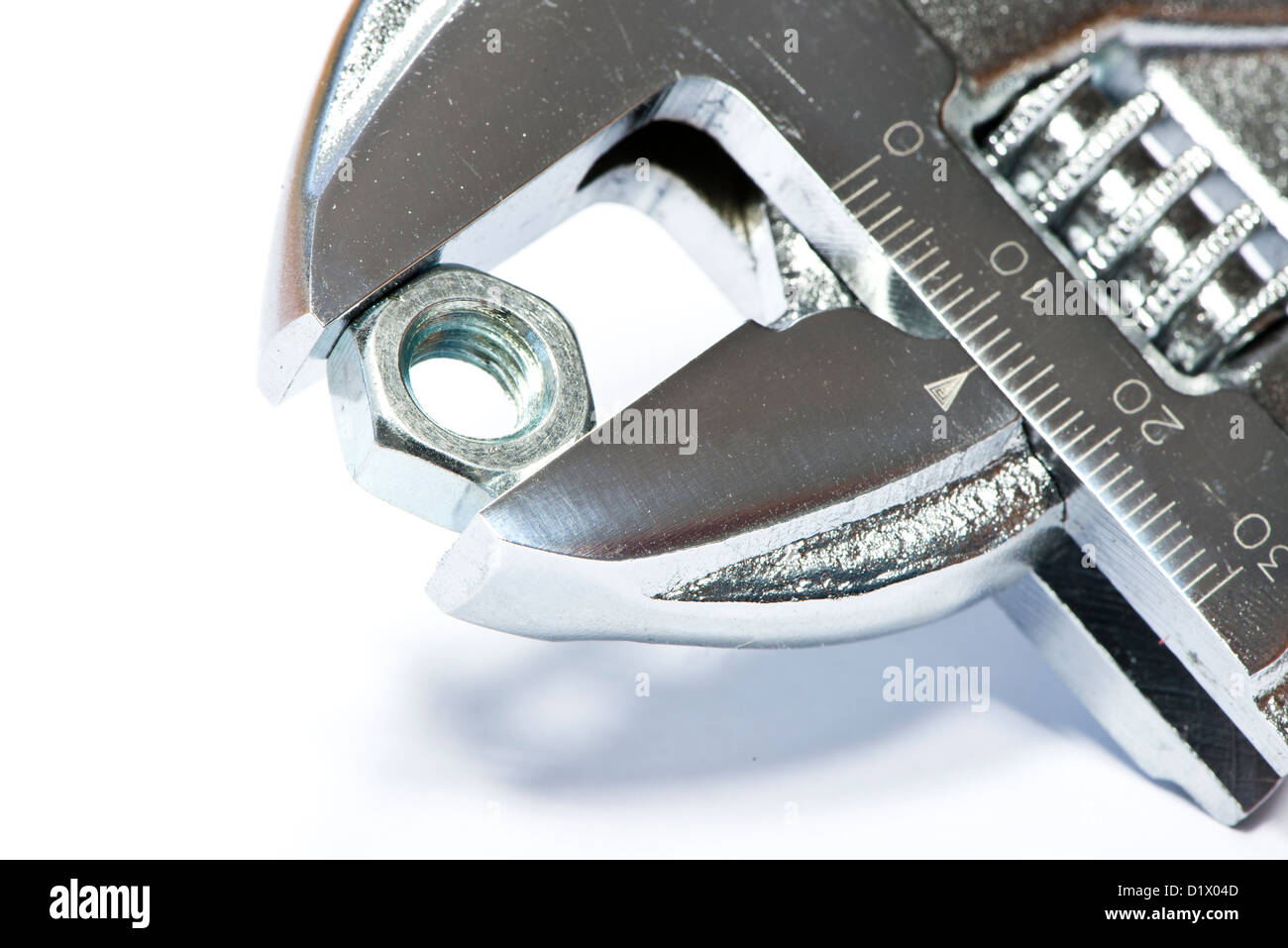 Wrench and screw on white background - closeup Stock Photo - Alamy