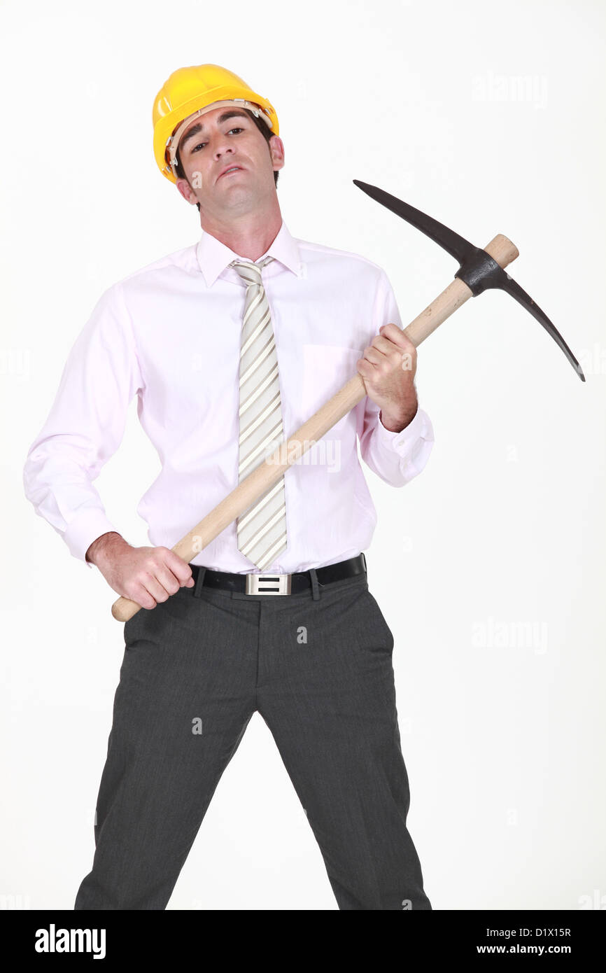 businessman holding a pickax Stock Photo - Alamy