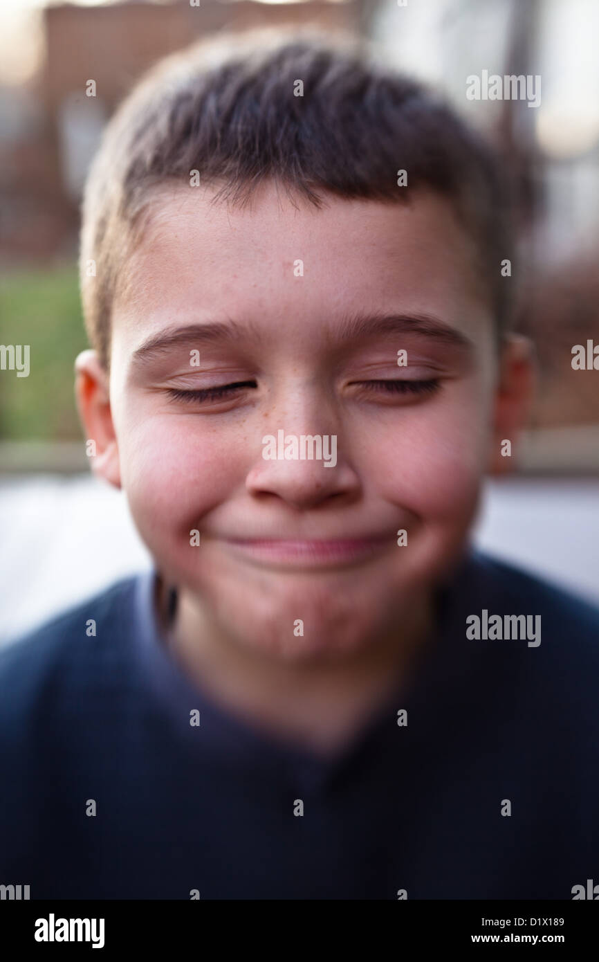 Little Boy making faces and being silly outside of his house Stock ...