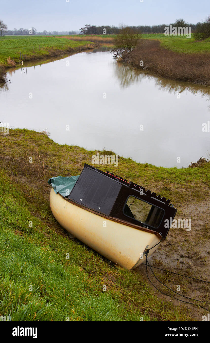 Boat stranded by flooded river Stock Photo - Alamy
