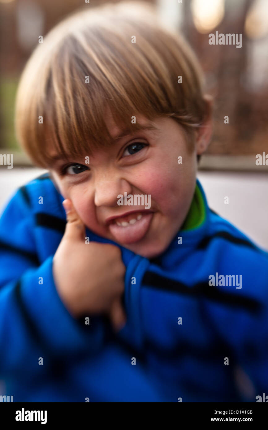 Little Boy making faces and being silly outside of his house Stock ...